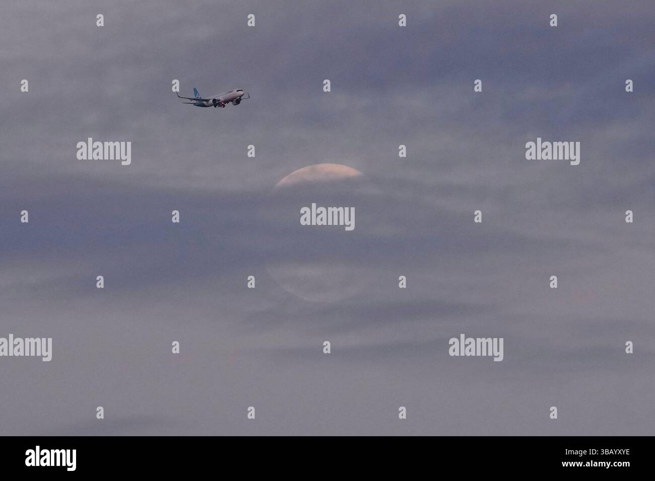 An Air Transat Airbus A321 lowers its landing gear when approaching for ...