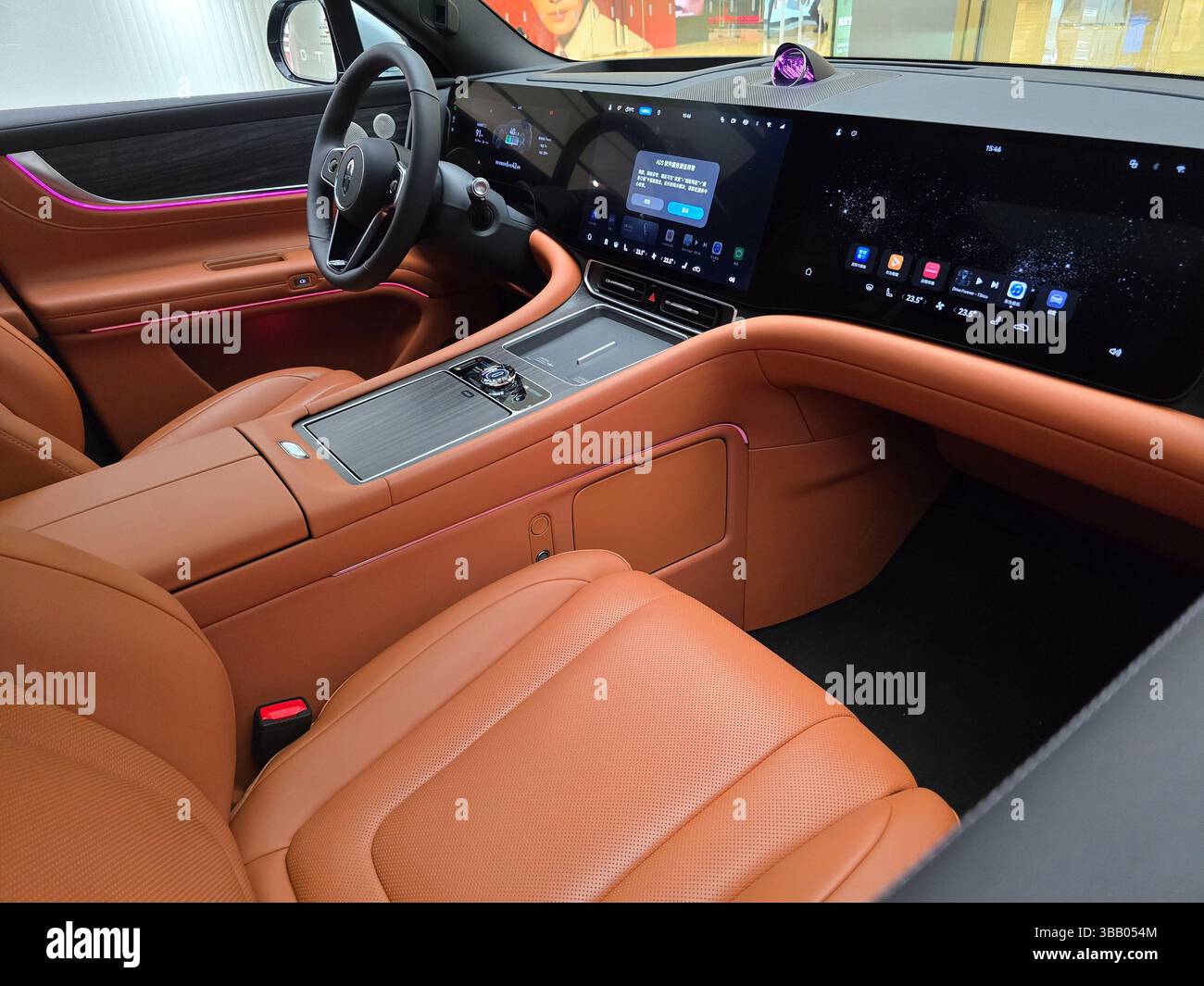 Close-up of the luxurious tan leather interior and full digital ...