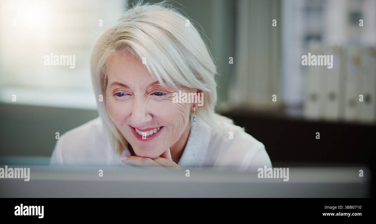 Thinking, computer and mature business woman with insight, planning and ...