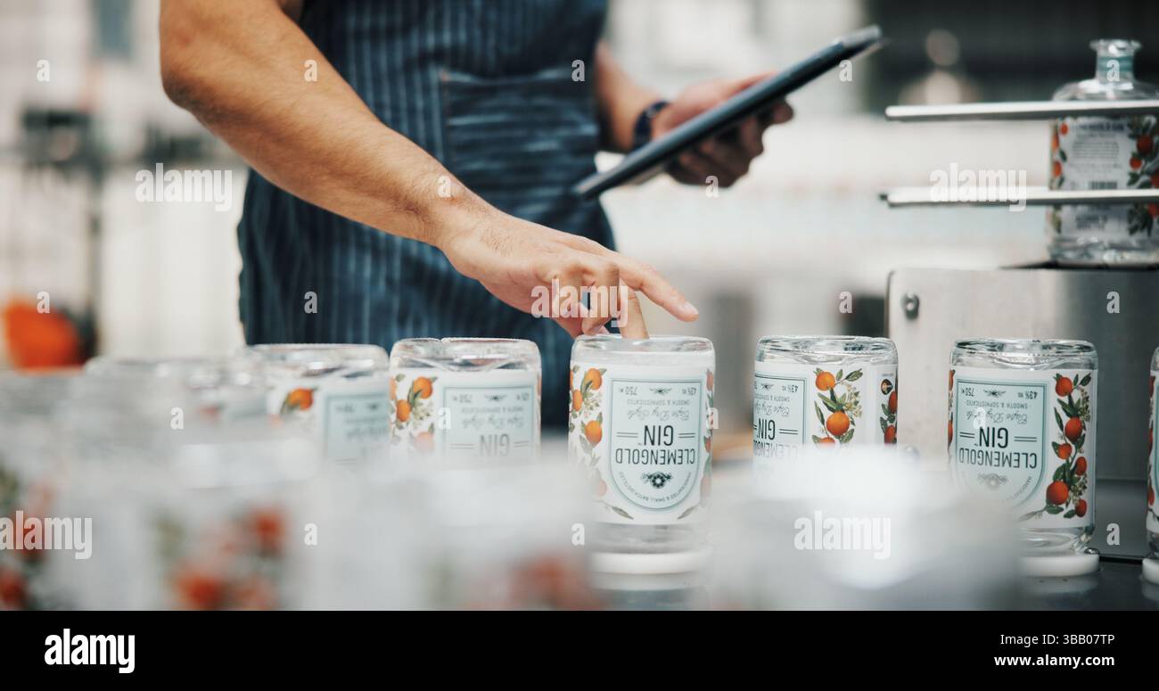 Distillery, bottle and tablet with hands in factory for packaging ...