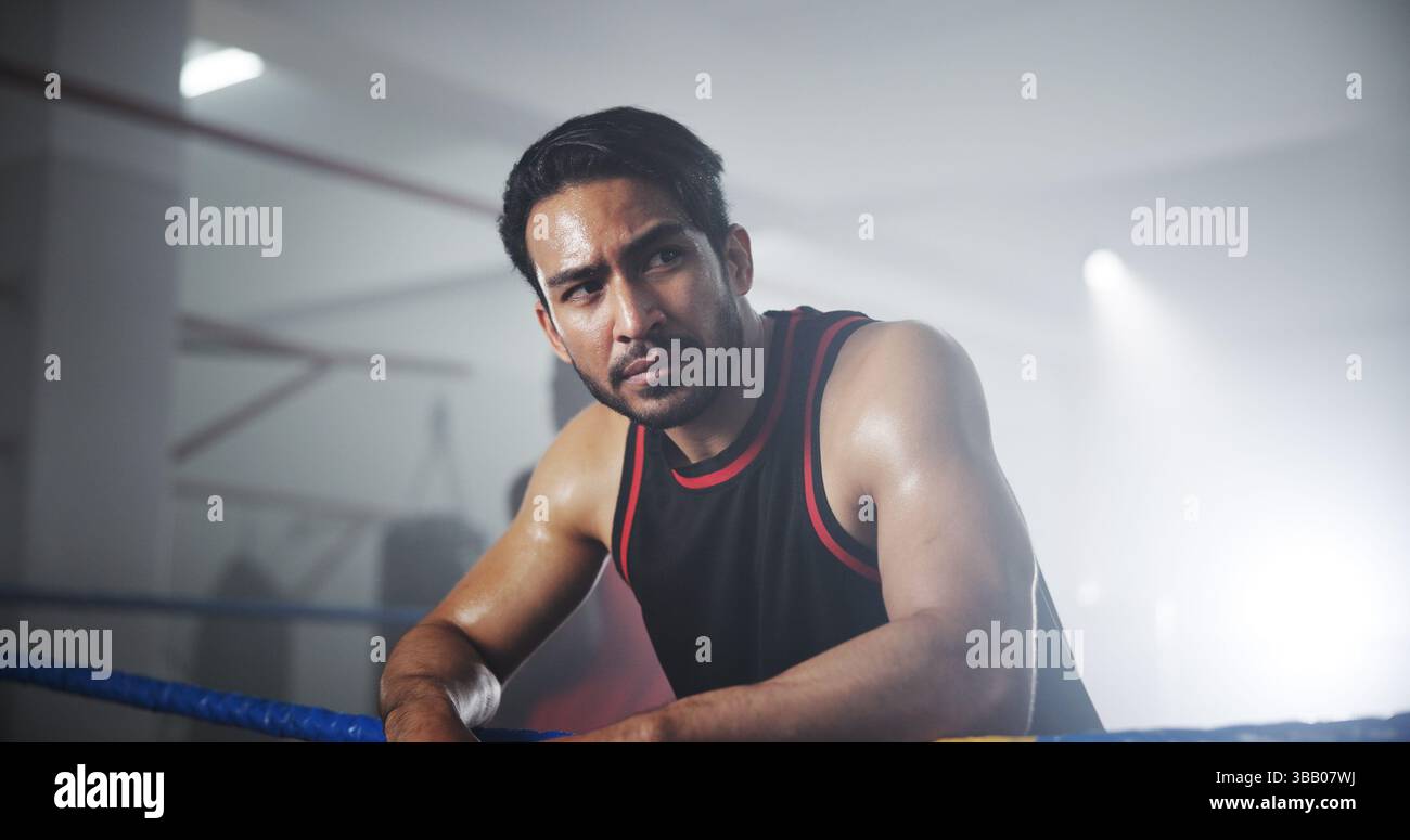 Man, boxer and sweating with thinking in gym, intense and recovery with ...