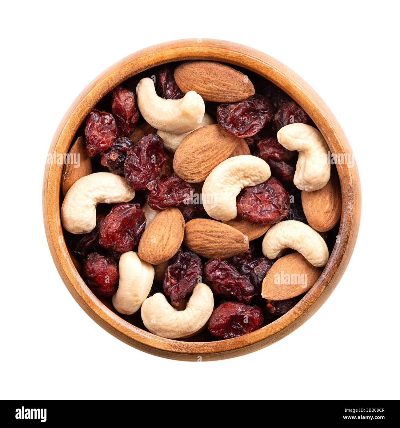 Cranberry almond cashew trail mix in a wooden bowl. Dried sweetened ...