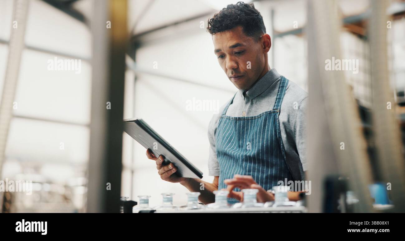 Distillery, tablet and man in factory for alcohol production ...