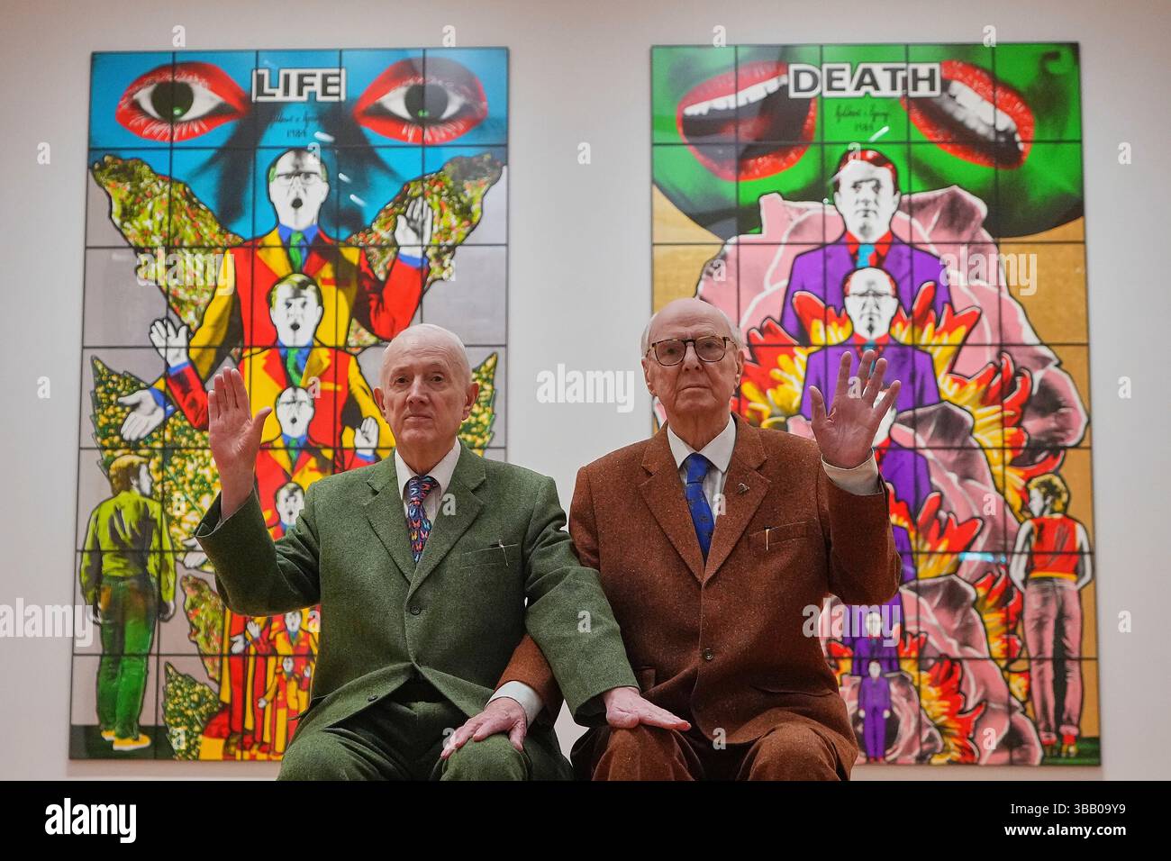Art duo Gilbert & George pose with artwork at their exhibition called ...
