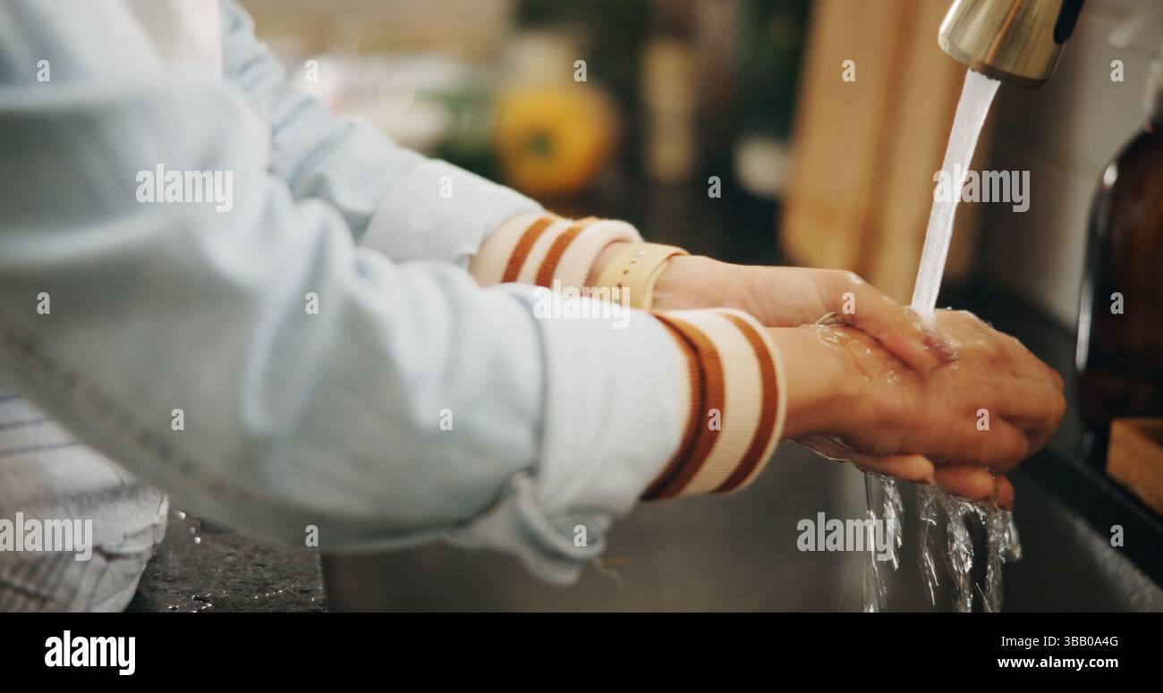 Washing hands, water and faucet in kitchen with hygiene, routine and ...