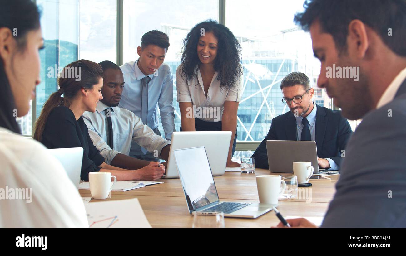 Business Team Around Table In Modern Office Collaborating Together ...