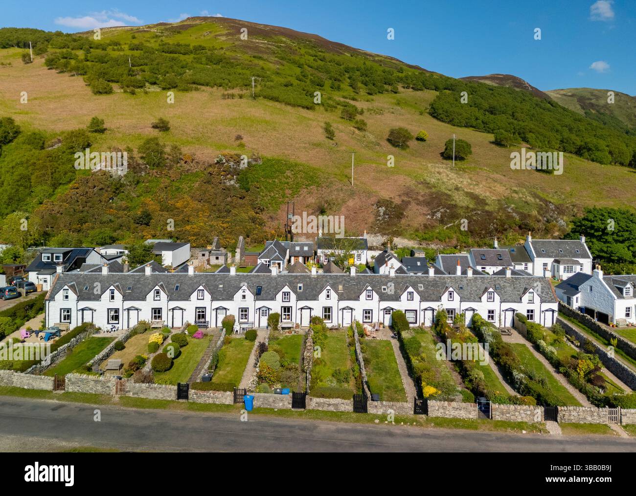 Aerial view from drone of village and row of twelve cottages called the ...