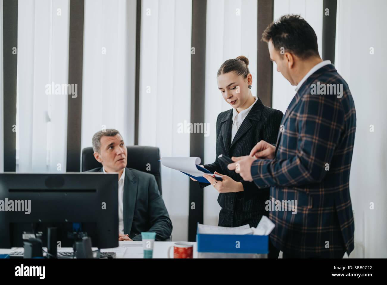 Team collaboration and discussion in a professional office setting ...