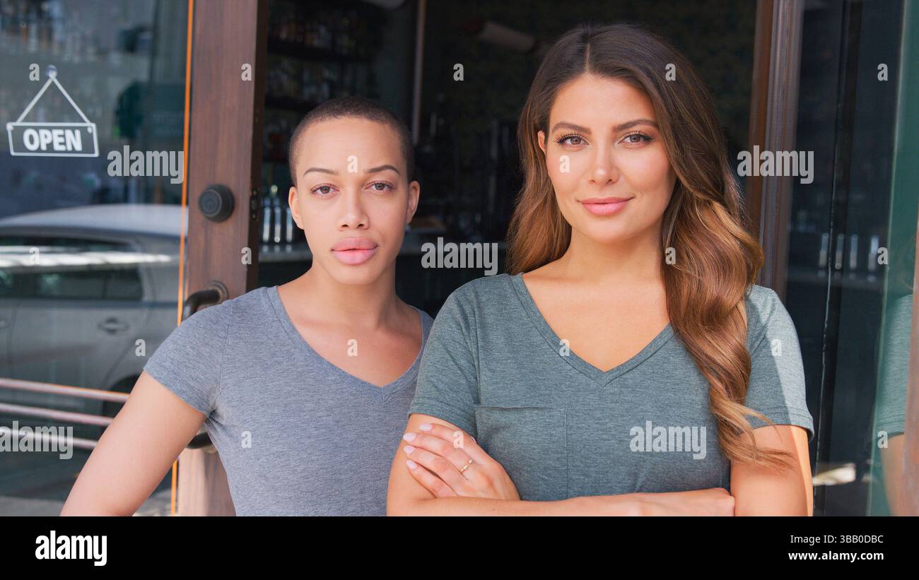 Portrait Of Two Female Coffee Shop Owners Standing Outside Store Front ...
