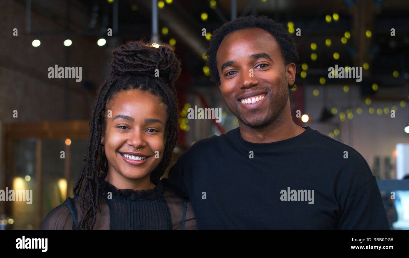 Portrait Of Smiling Male And Female Staff In Bar Restaurant Stock Photo ...