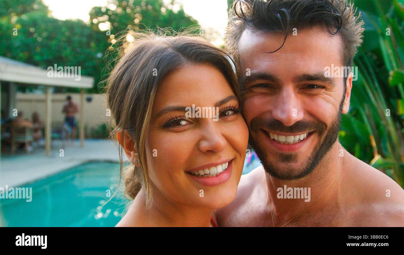 Portrait Of Romantic Hispanic Couple Outdoors With Friends Enjoying ...