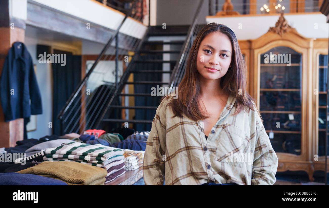 Portrait Of Smiling Female Owner Of Fashion Store Standing In Front Of ...
