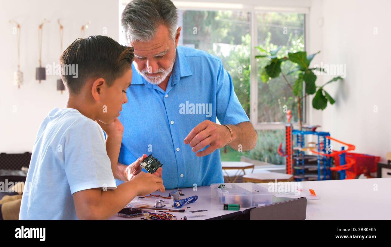Boy making robot using building hi-res stock photography and images - Alamy