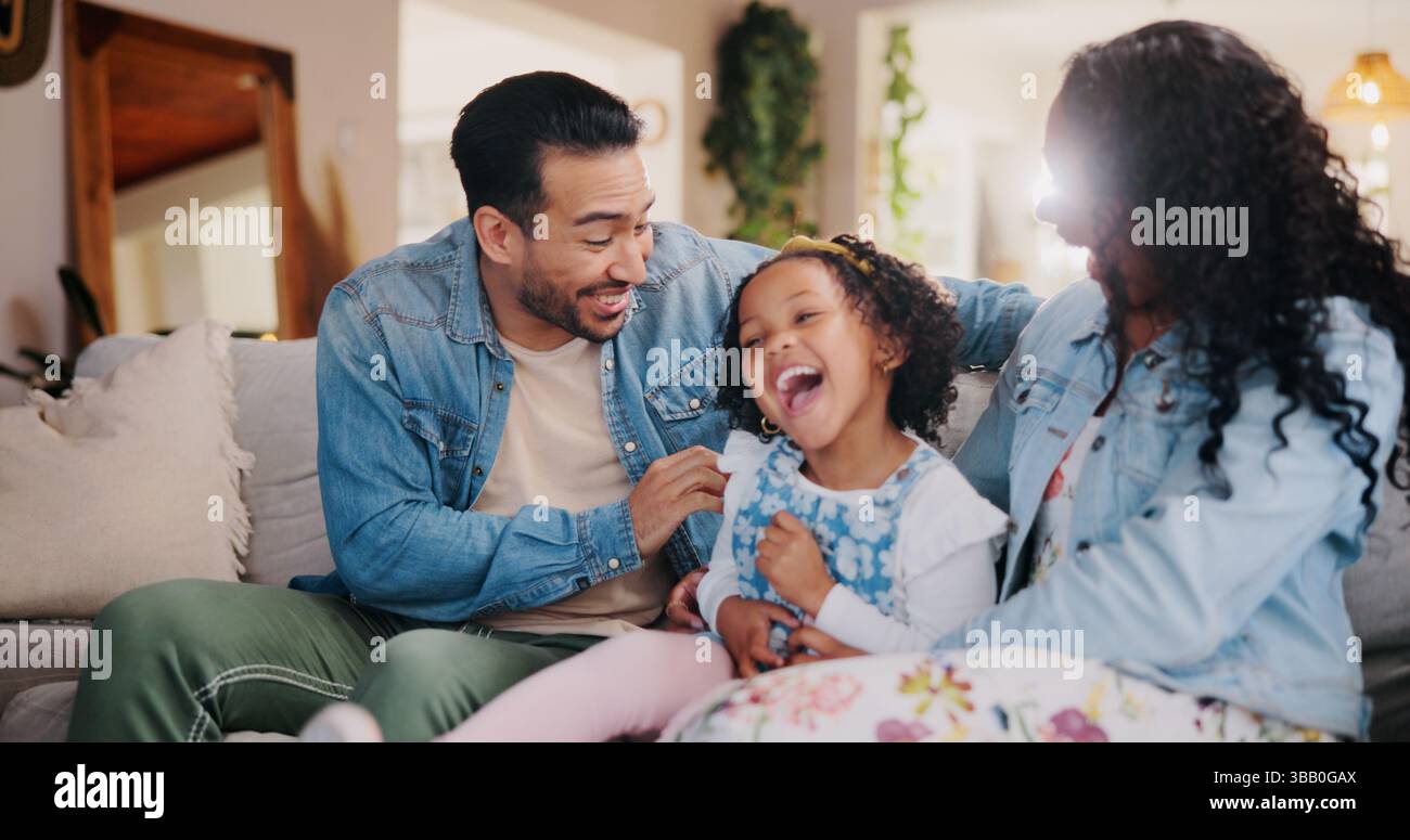 Parents, girl and tickle on couch, laugh and bonding with love, comic ...