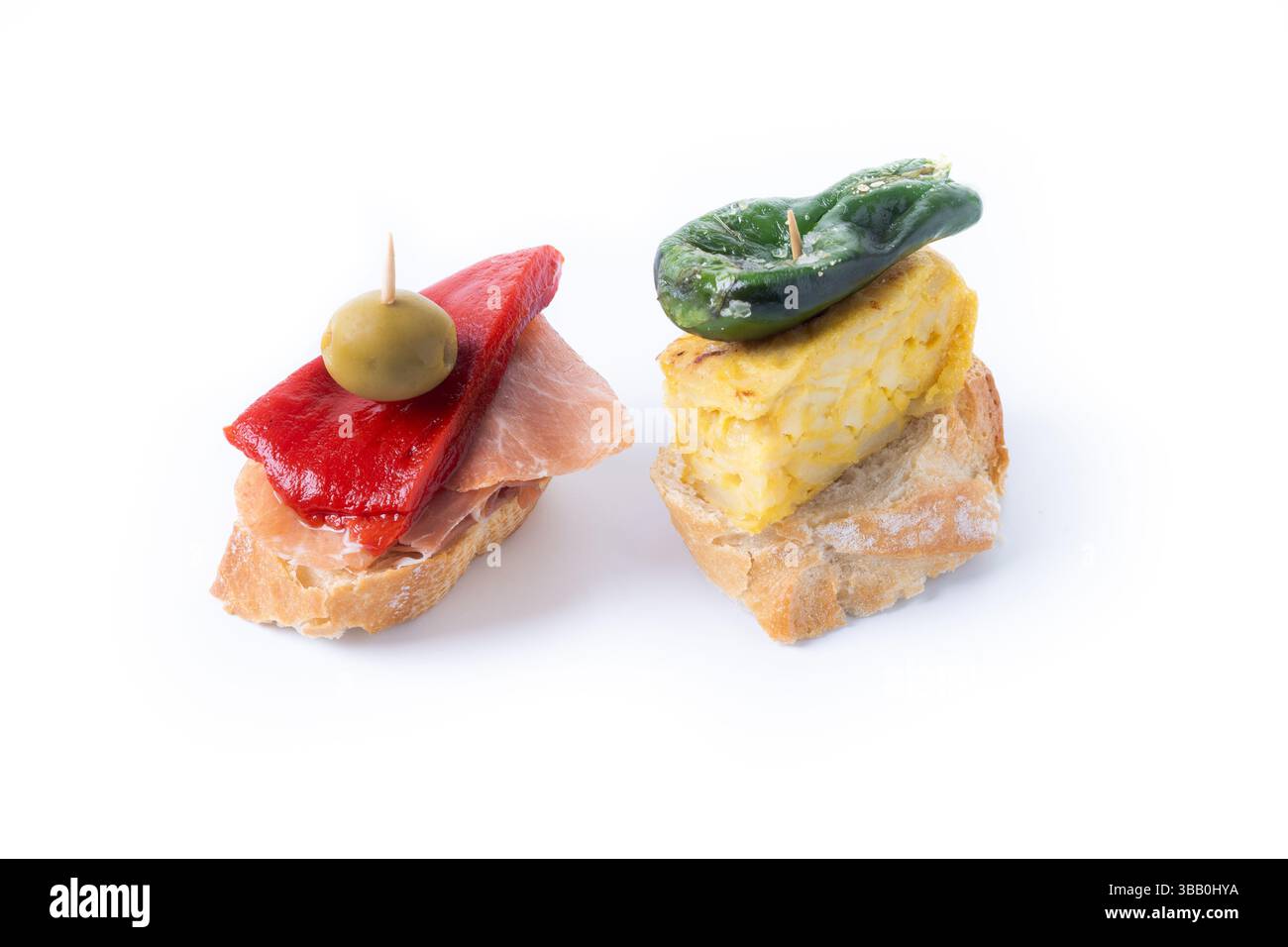Traditional Spanish pintxos isolated on white background Stock Photo ...