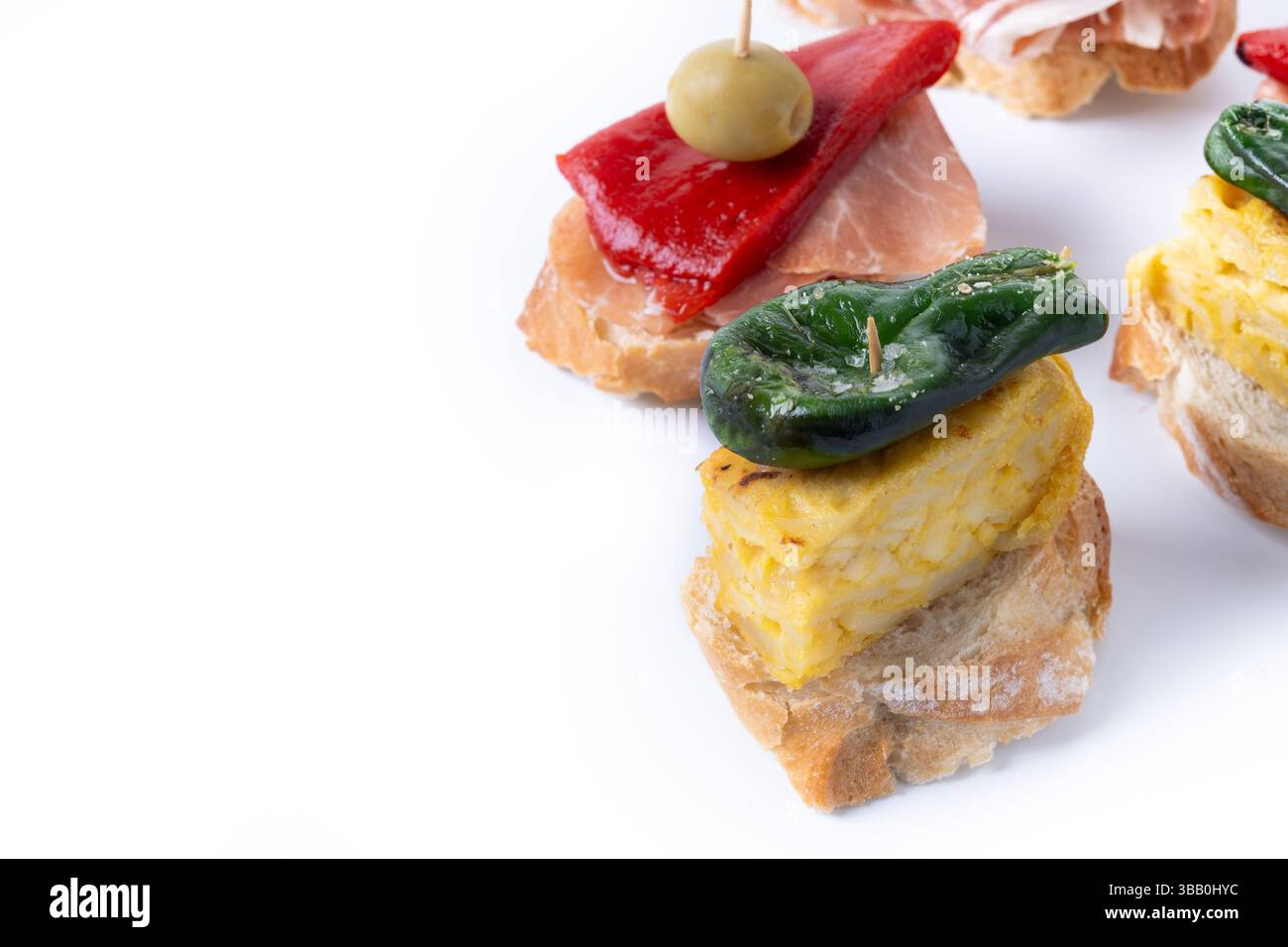 Traditional Spanish pintxos isolated on white background Stock Photo ...