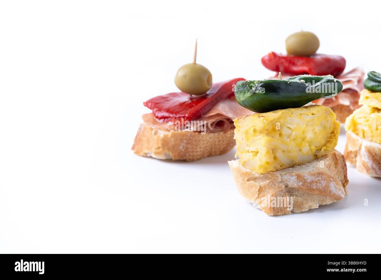 Traditional Spanish pintxos isolated on white background Stock Photo ...
