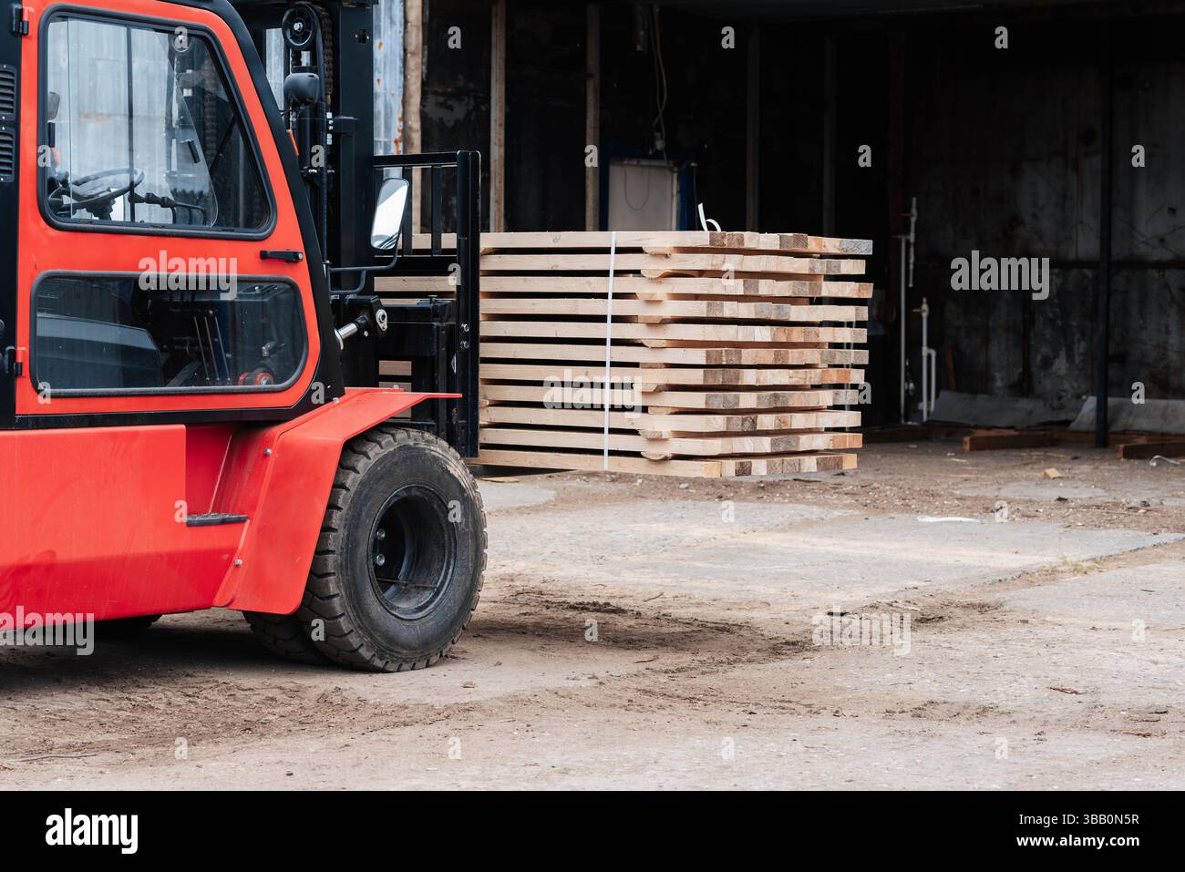 Forklift loader load lumber into a dry kiln. Wood drying in containers ...