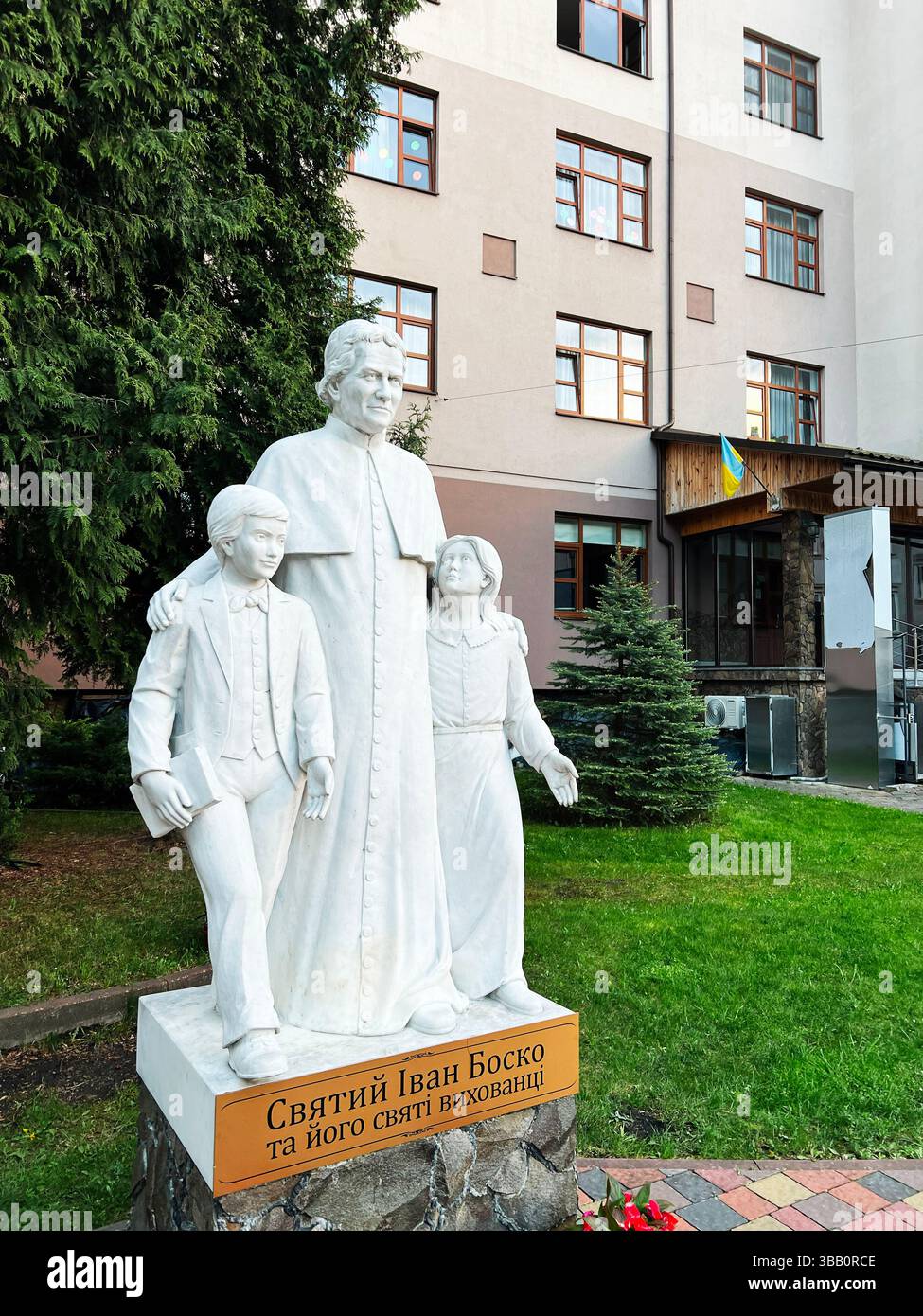 Lviv, Ukraine - May 14, 2025: A statue of Saint Ivan Don Bosco with ...