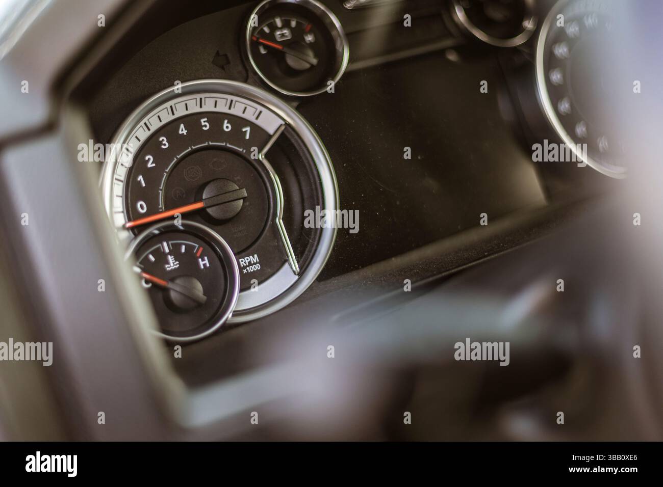 Modern car dashboard displaying various indicators, including ...