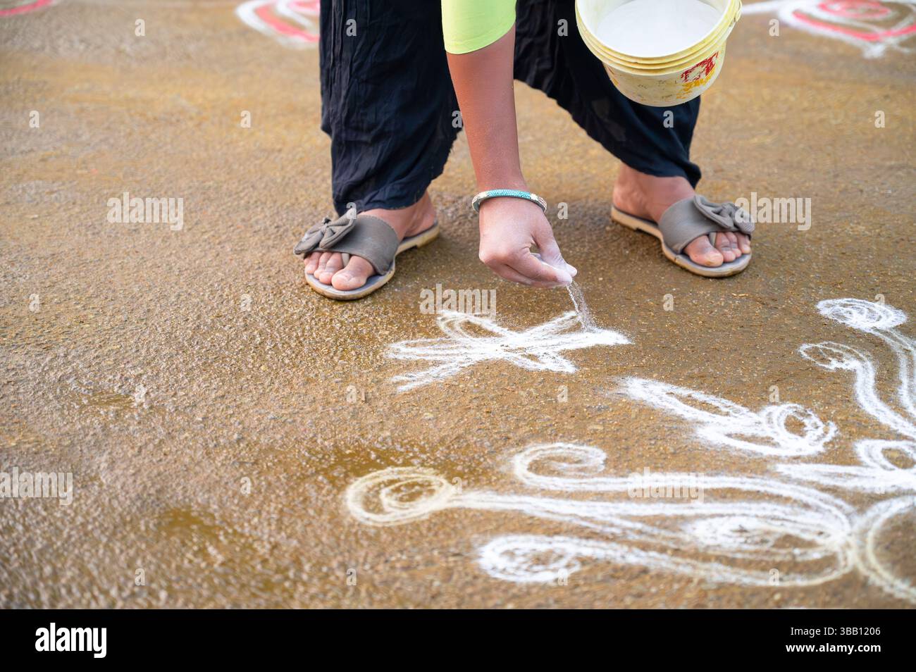 Kolam, colorful sandpainting with rice powder drawn by women and girls ...