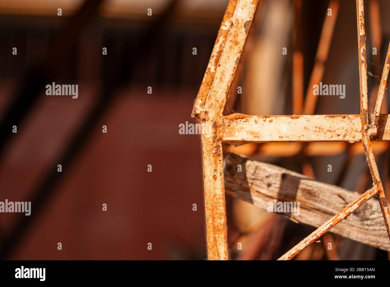 Close-up of a rusty metal structure with peeling paint, highlighting ...