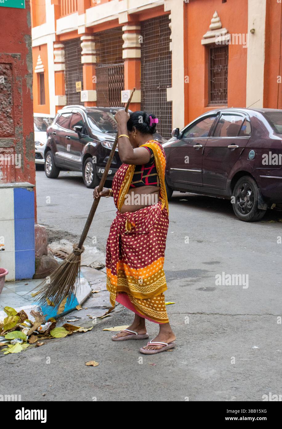 KOLKATA, WEST BENGAL, INDIA - FEBRUARY 19, 2024 woman street sweeper ...