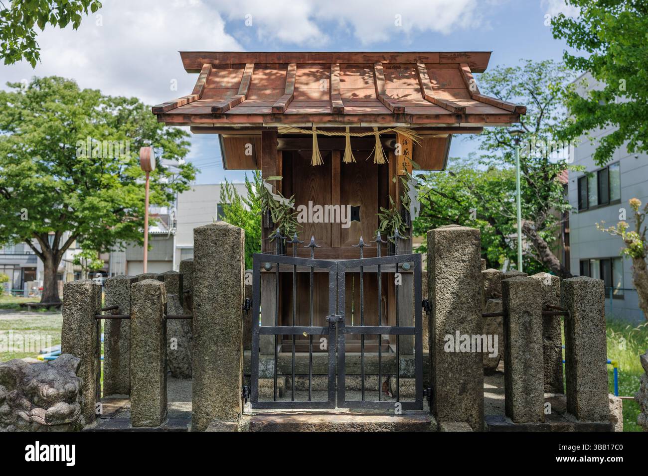 Miniature Japanese Hokora shrine sits on corner of small, neighborhood ...