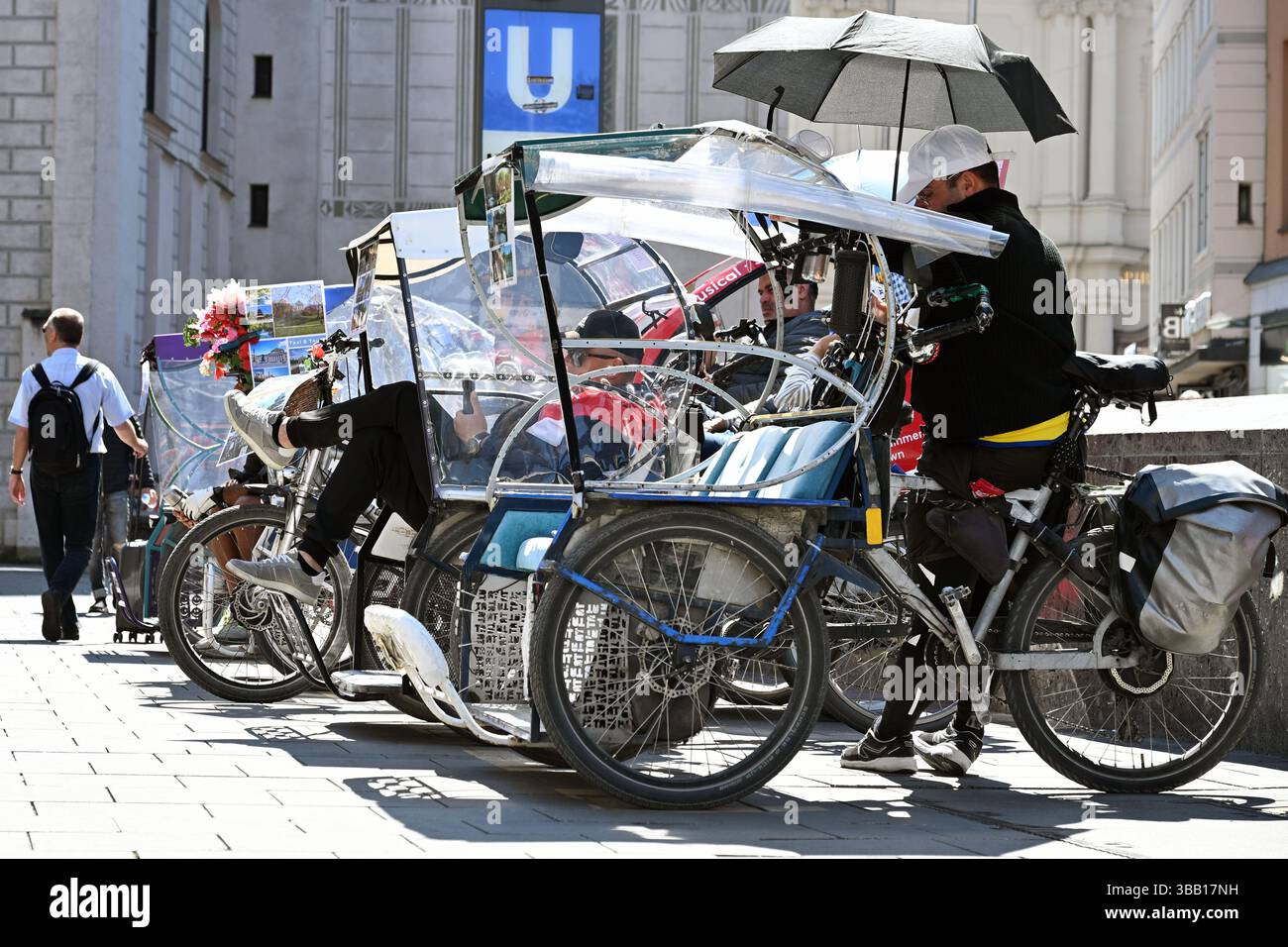 Munich, Deutschland. 13th May, 2025. Rickshaw drivers on Marienplatz in ...