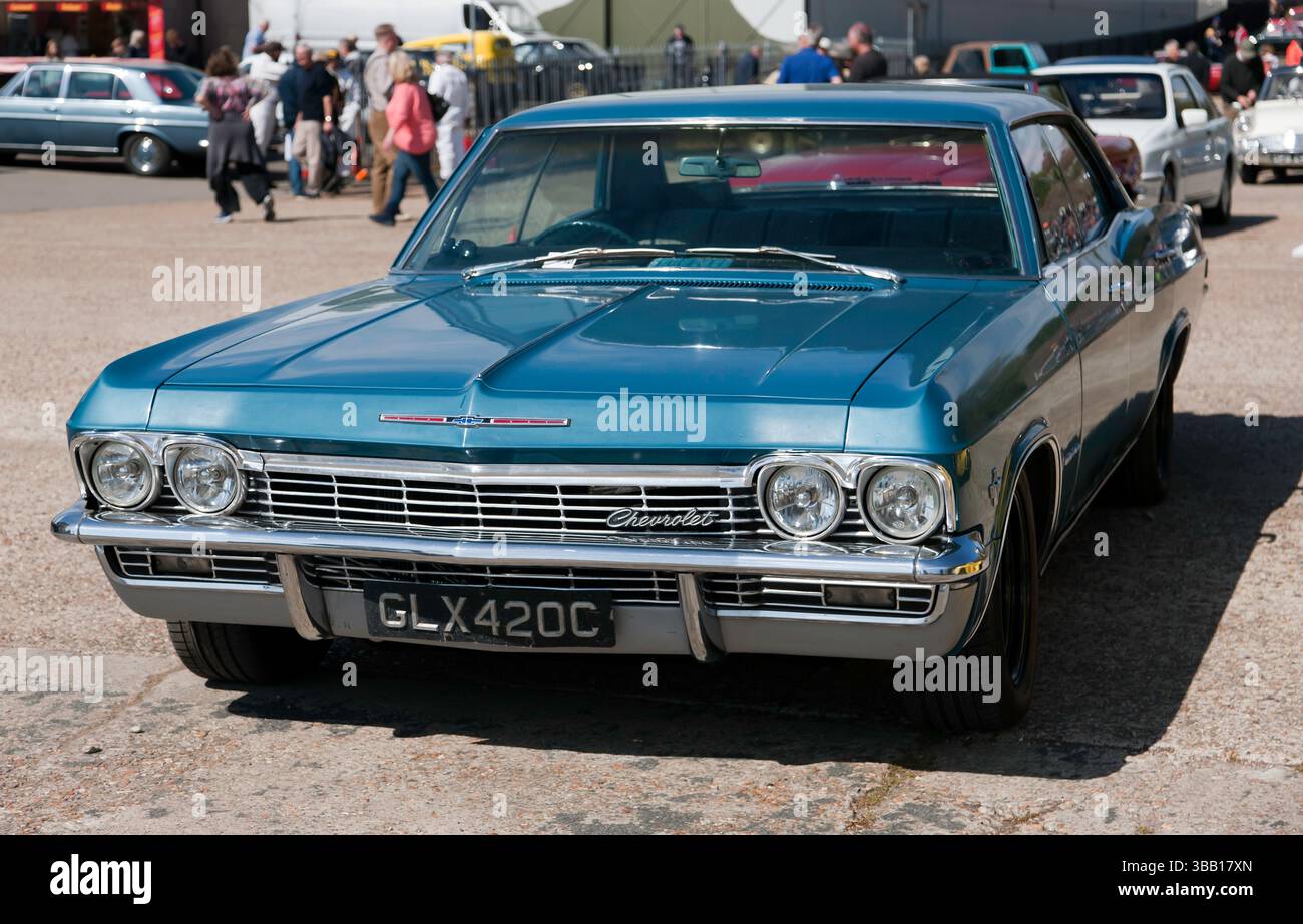 Three-quarter front view of a Blue, 1965, Chevrolet Impala, on display ...