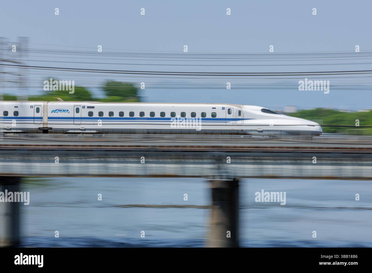 Leading car of Japan's Nozomi Shinkansen Bullet train is captured in ...