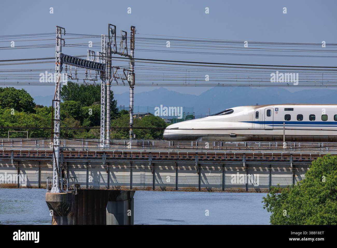 Lead car of Japan's Nozomi Bullet train captured on bridge over Shonai ...