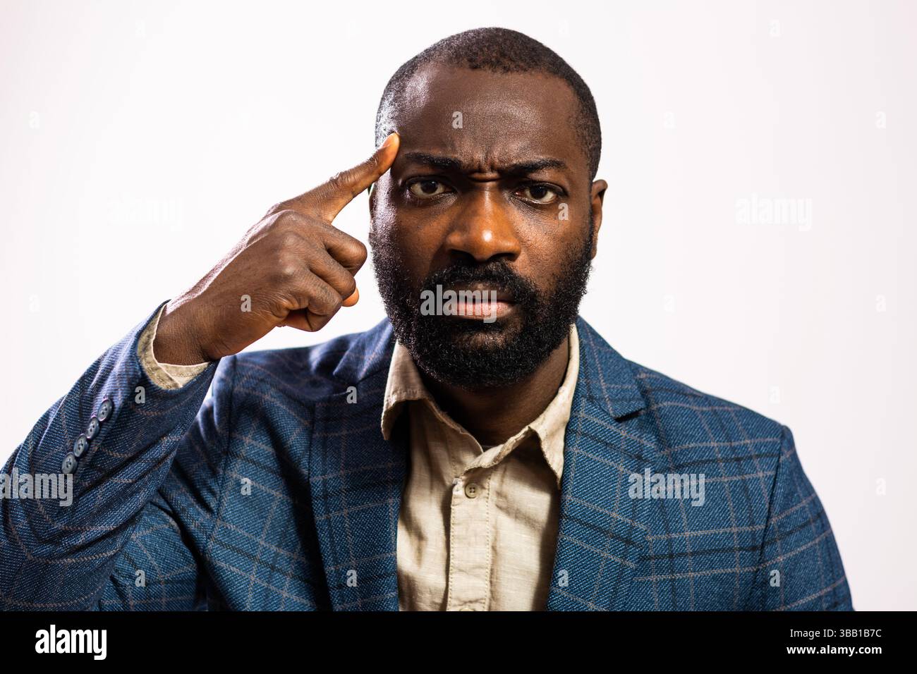 Portrait of serious and worried businessman. Black man in business suit ...