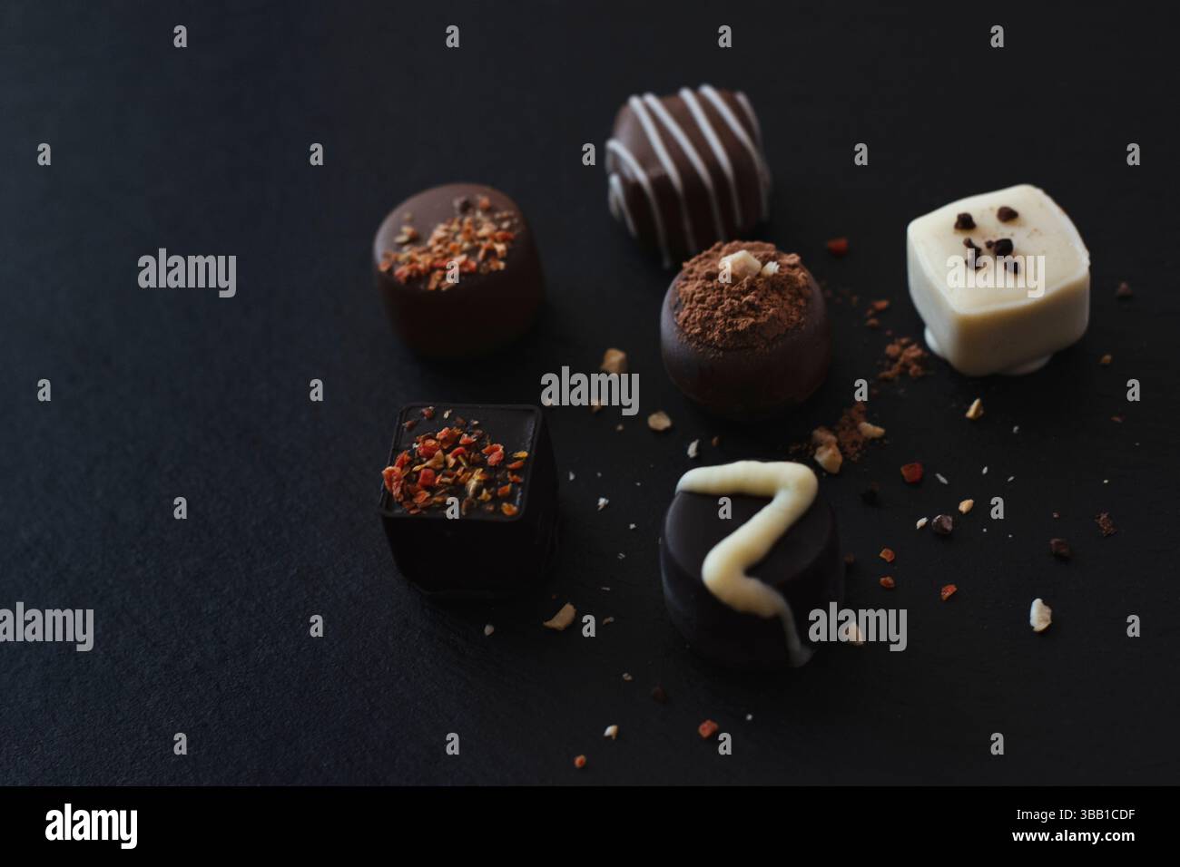 Luxury chocolate assortment on a dark tray Stock Photo - Alamy