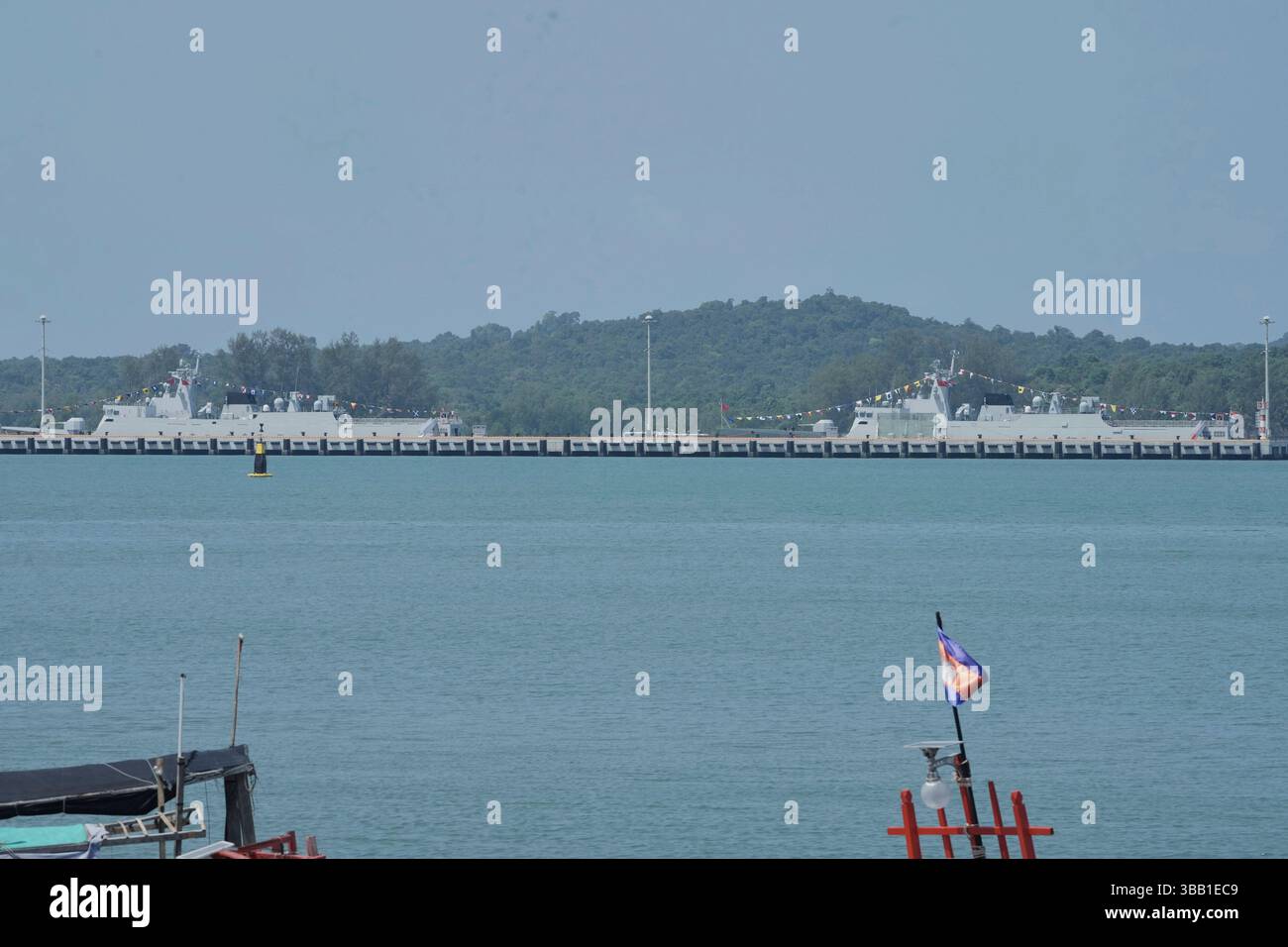 FILE - Chinese warships dock at a naval base's pier during an official ...