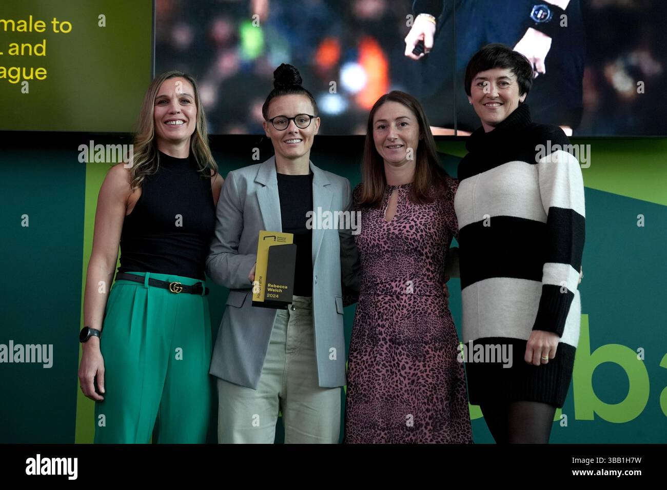 Former football referee Rebecca Welch (second left) poses with her ...