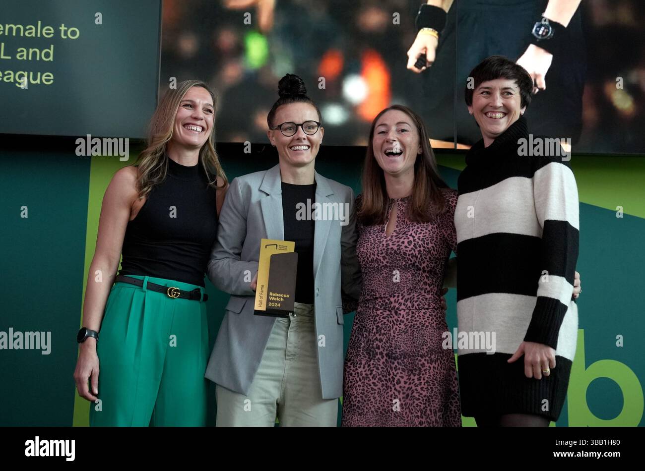 Former football referee Rebecca Welch (second left) poses with her ...