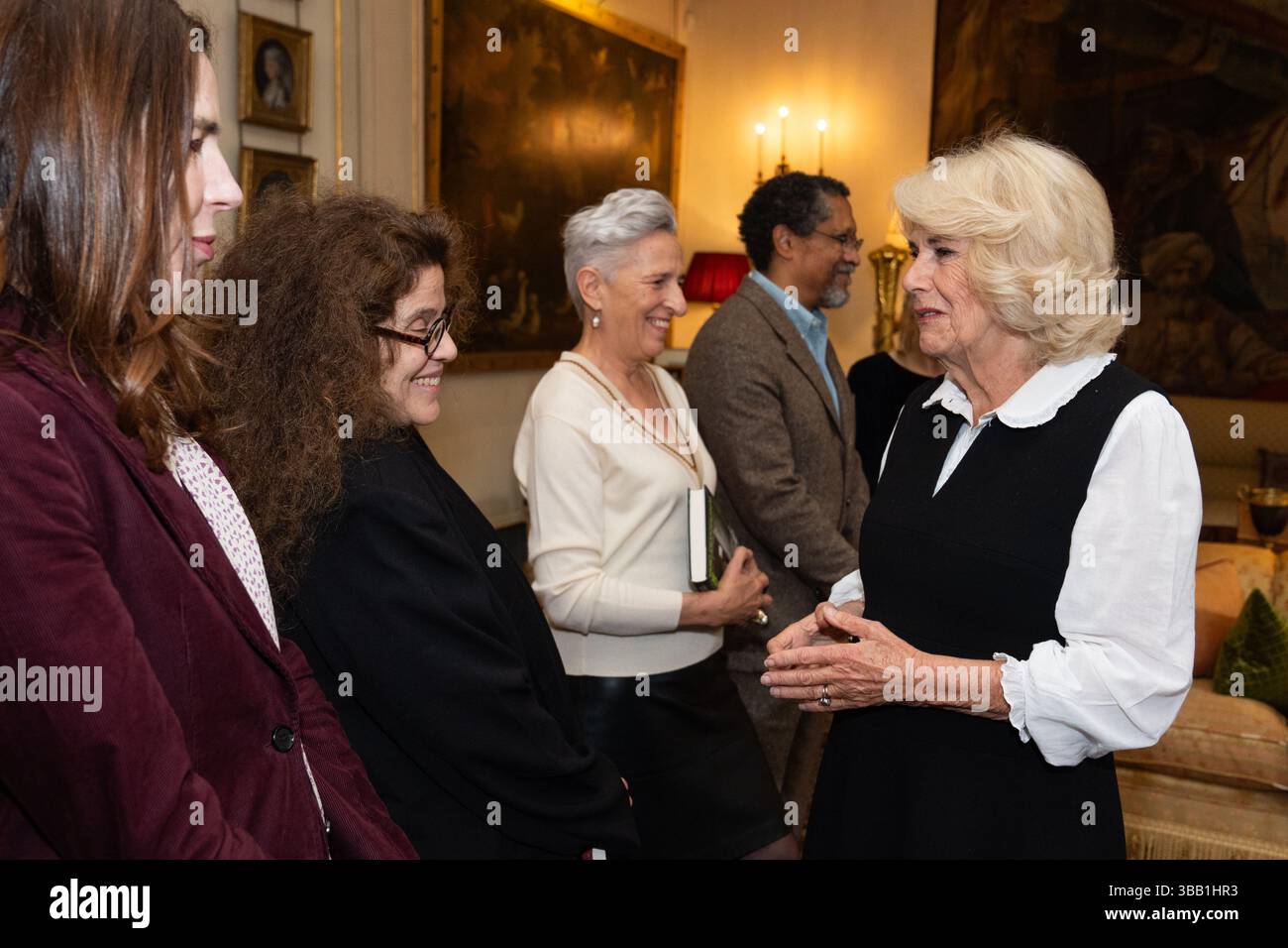 Queen Camilla talks with Anne Michaels during a reception for the ...