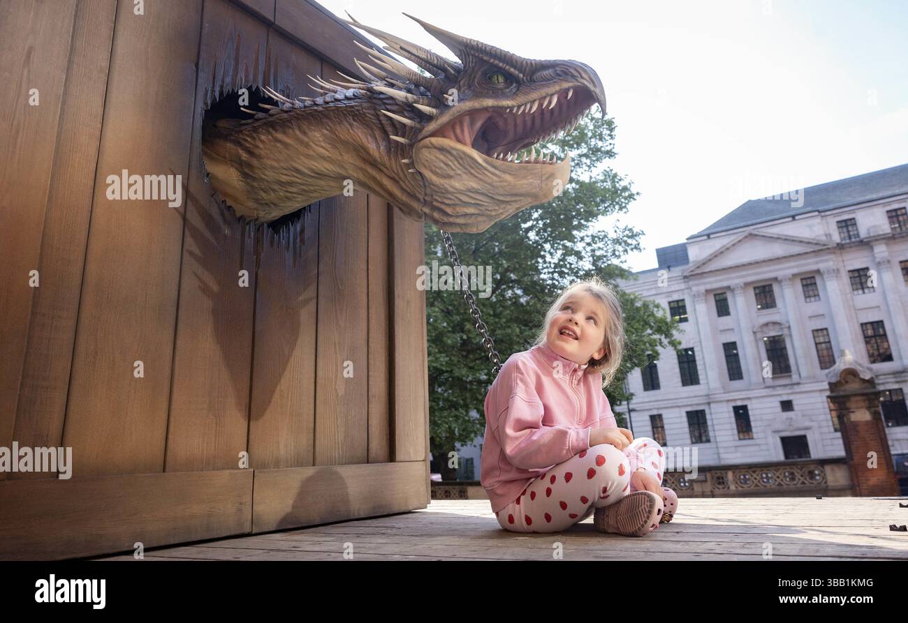 EDITORIAL USE ONLY Rae McFarlane, age 5, reacts to a 25-ft-long ...