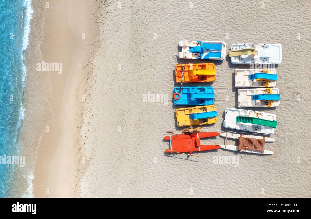 Aerial view of colorful catamarans on sandy beach and blue sea Stock ...