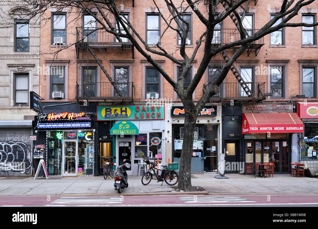 Old buildings with shops and restaurants in East Village area of ...