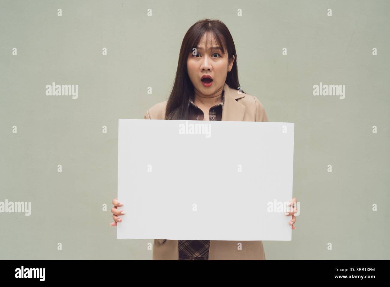 Shocked woman looking camera standing hi-res stock photography and images - Alamy