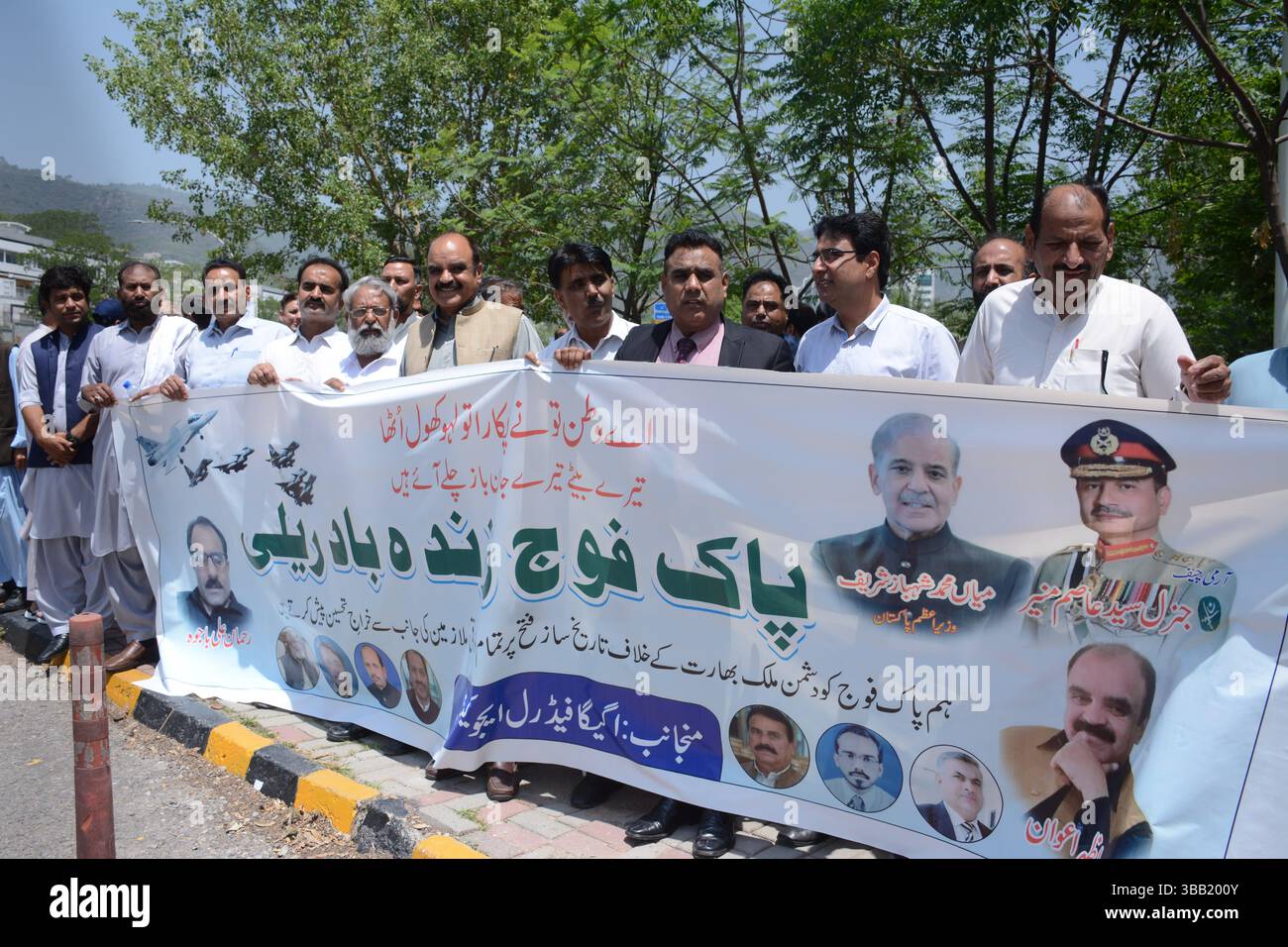 Islamabad, Pakistan, Pakistan. 14th May, 2025. People hold flags as ...