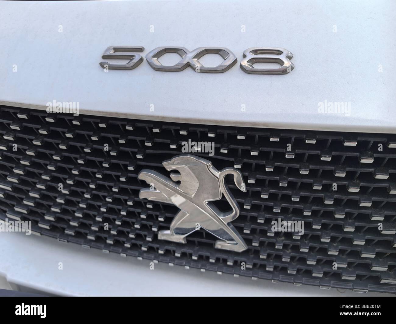 Minsk, Belarus - April 28, 2025: The front grill of a Peugeot 5008 gleams in the sunlight. The ...