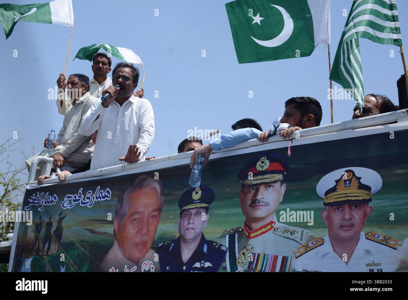 Islamabad, Pakistan, Pakistan. 14th May, 2025. People hold flags as ...