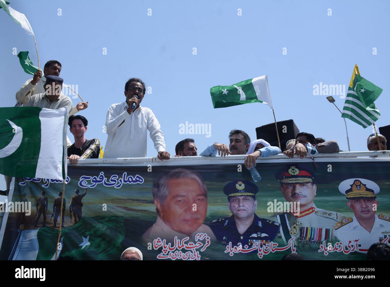 Islamabad, Pakistan, Pakistan. 14th May, 2025. People hold flags as ...
