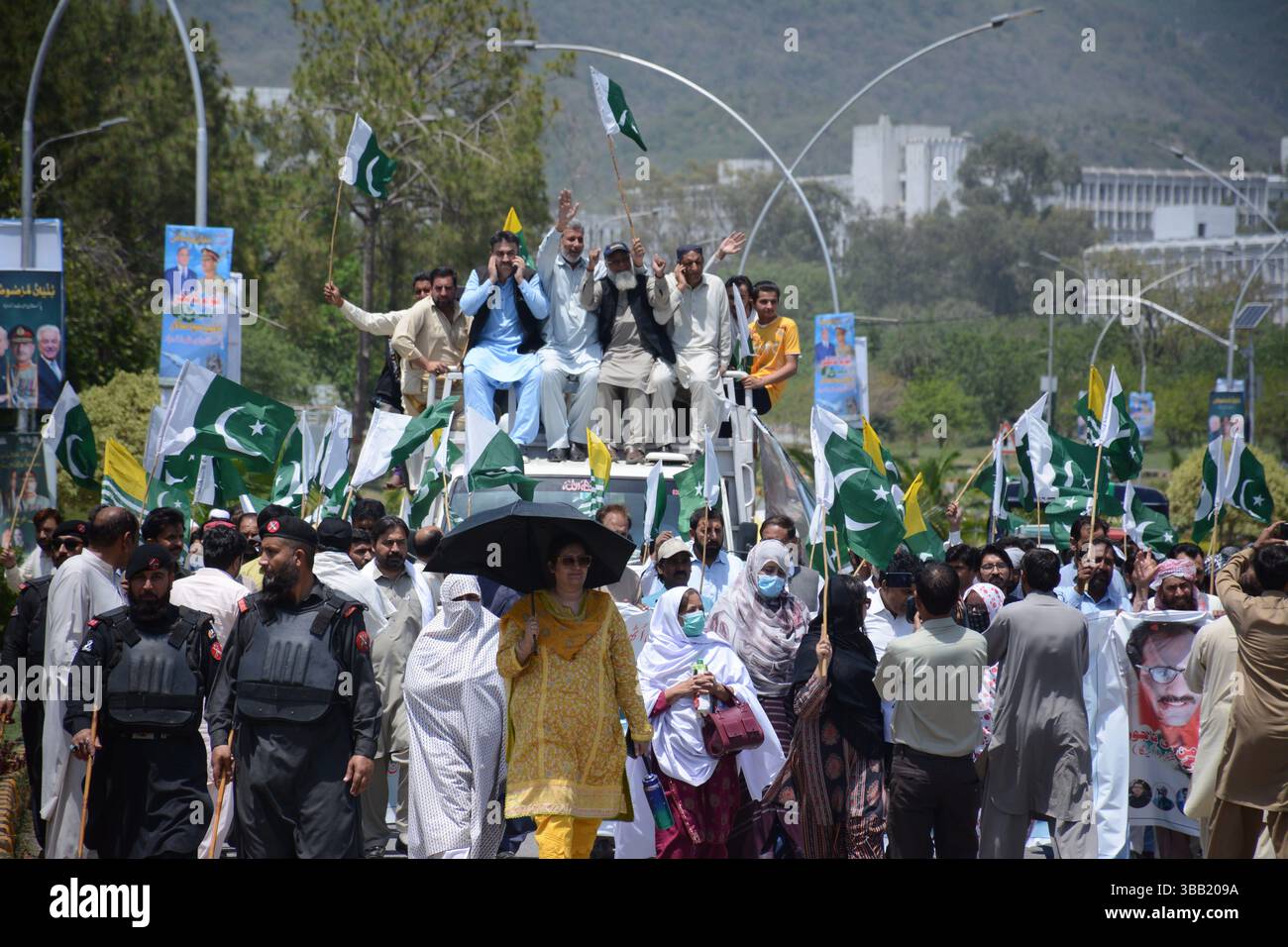 Islamabad, Pakistan, Pakistan. 14th May, 2025. People hold flags as ...