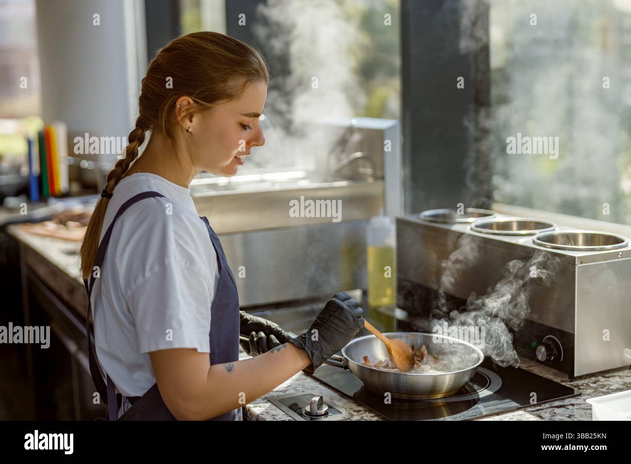 Culinary Passion A Young and Talented Chef Enthusiastically Cooking in ...
