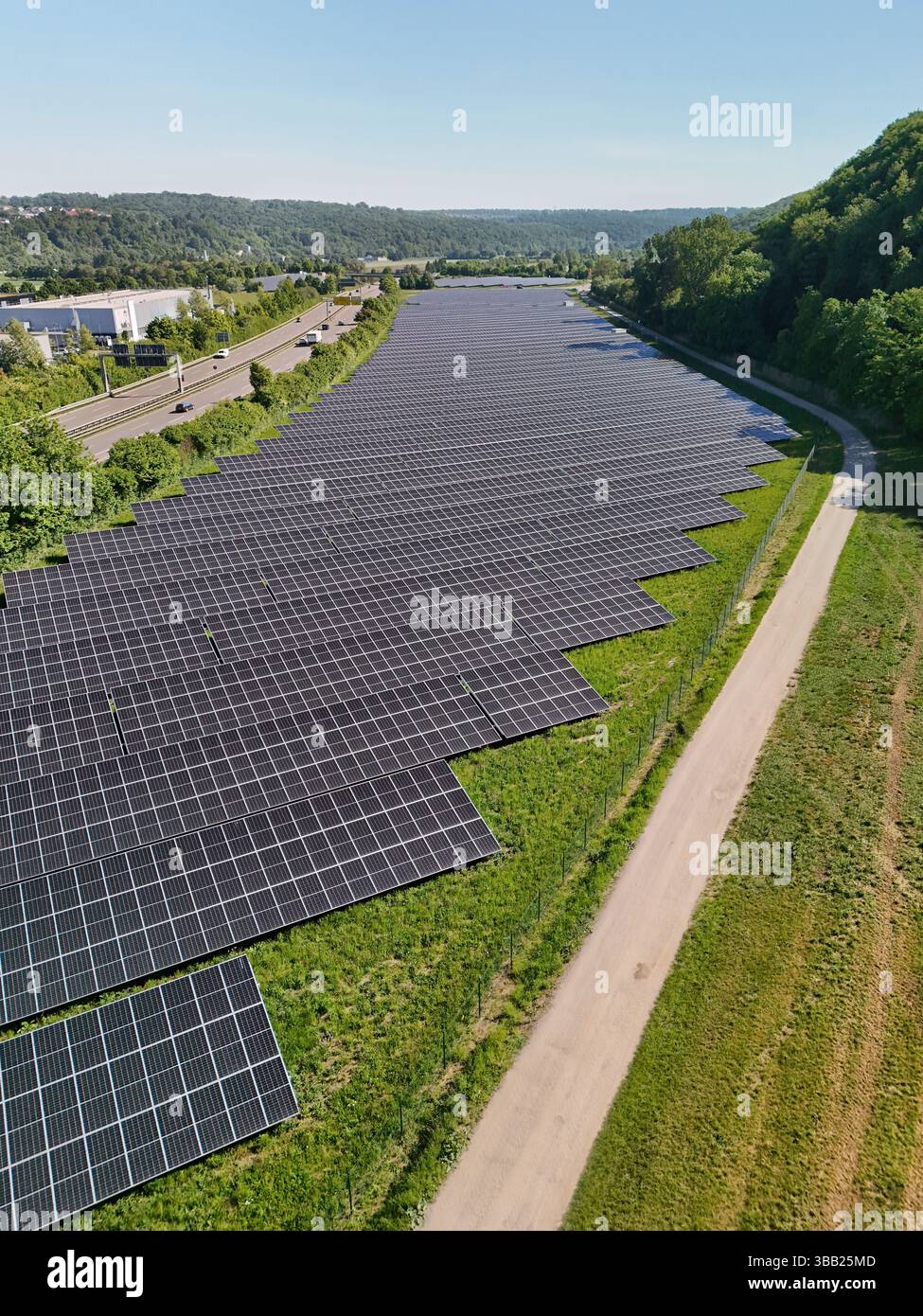 Aerial drone photo of photovoltaic solar panels next to the motorway ...