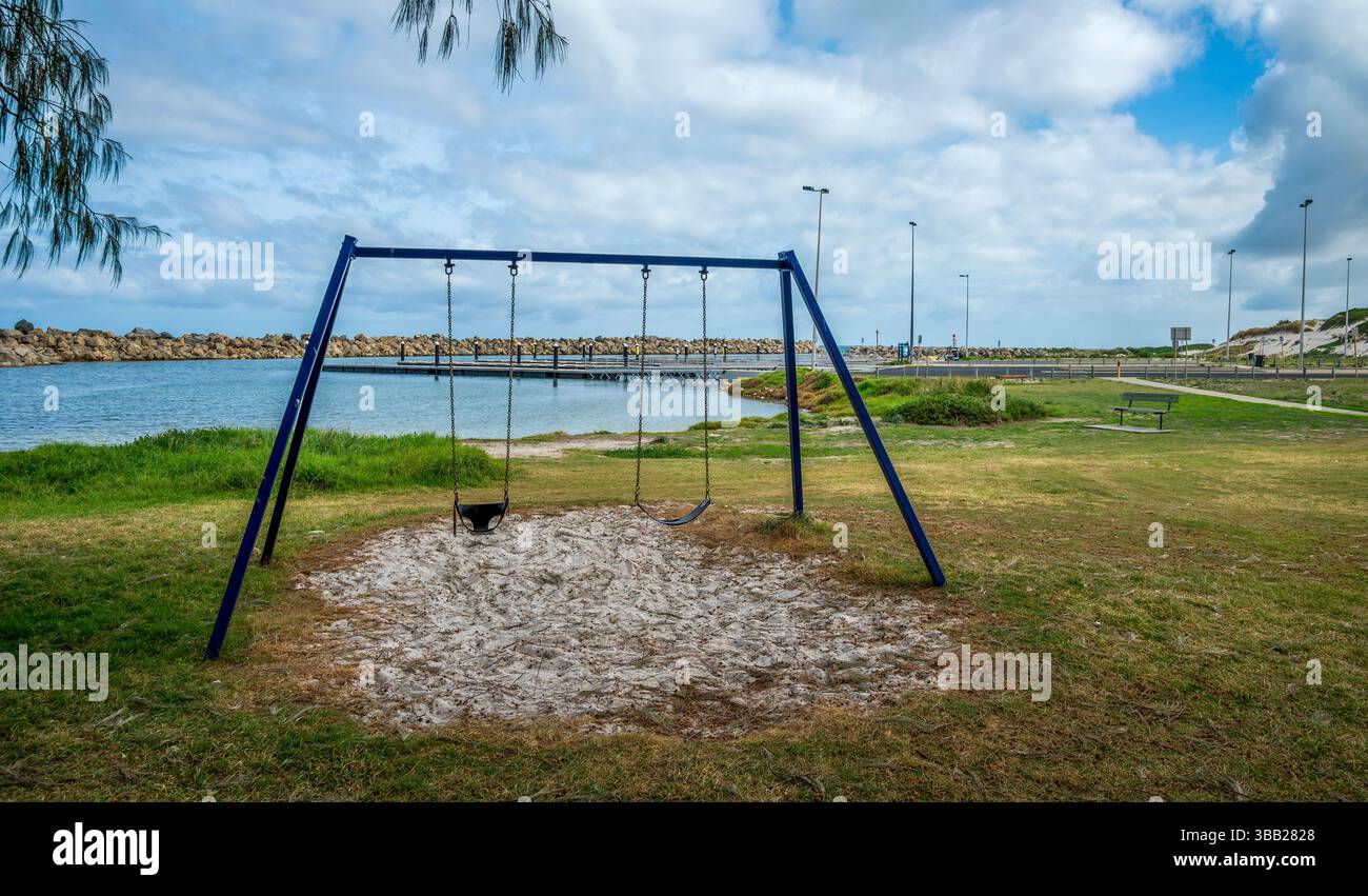 Children swing set ocean hi-res stock photography and images - Alamy